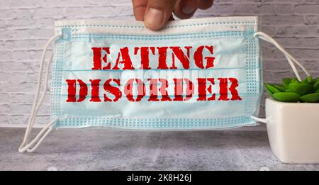 Eating disorders sentence on a wood table Stock Photo - Alamy