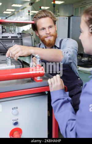 portrait of engineers using cad programming software at factory Stock ...