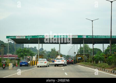 Vehicle passing through Nazirakahat (Sonapur) toll gate towards upper ...