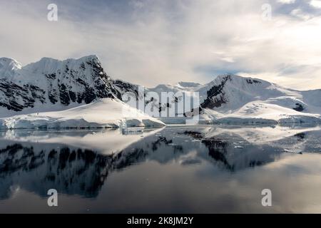 still waters of paradise harbour (bay) with mt. hoegh (c) on danco ...