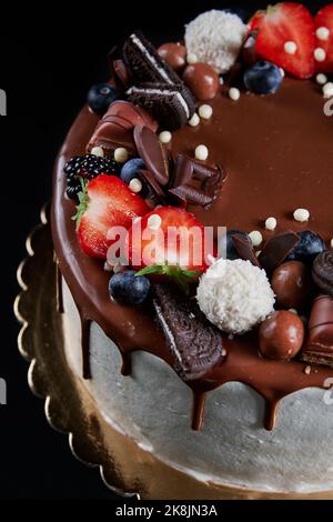 Birthday cake on dark background. Close up of cake decorated with fresh ...
