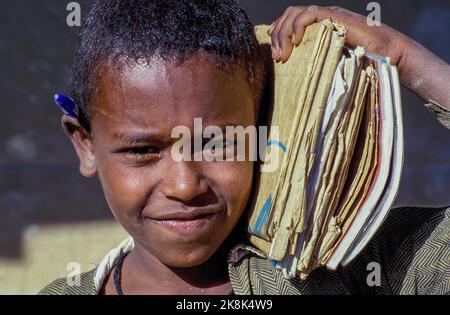 Ethiopia, Tigray - Boy is going to primary school with schoolbooks on ...