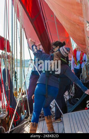 Crew working aboard the traditional gaff cutter "Jolie Brise" in the ...