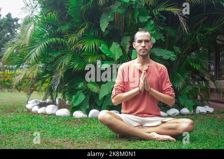 A man caressing himself in A lotus position facing forward Stock Photo ...