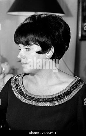 French singer Régine posing in her apartment, probably located near ...