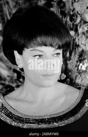 French singer Régine posing in her apartment, probably located near ...