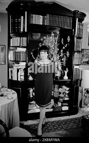 French singer Régine posing in her apartment, probably located near ...