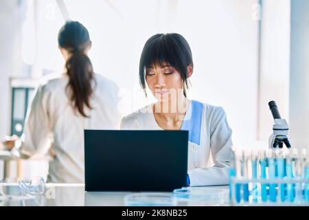 Female scientists working on their computers In modern medical research ...