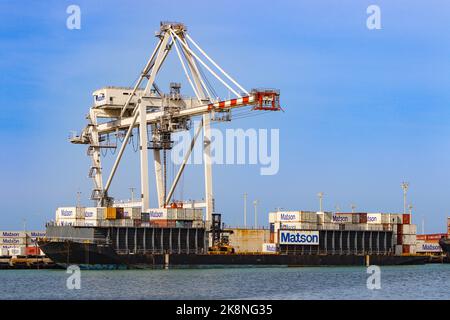A Matson offloading cargo docking station in Hawaii with ships, clear ...