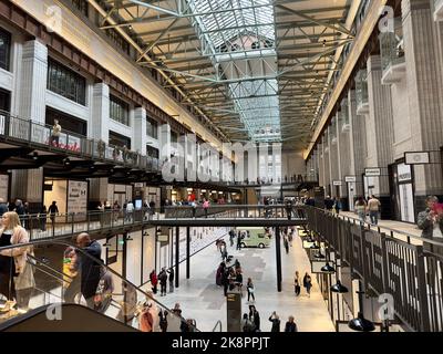 Crowded shopping mall inside the Battersea Power Station in London ...