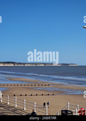 A vertical shot of a sandy beach of an azure sea Stock Photo - Alamy