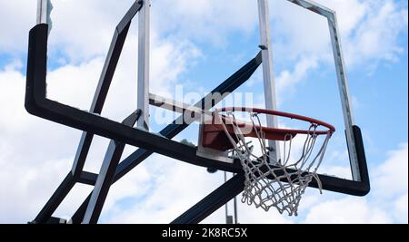 Broken glass backboard and broken hoop on the basketball court Stock ...