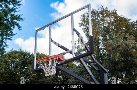 Broken glass backboard and broken hoop on the basketball court Stock ...