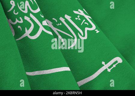 Saudi Arabia flag with big folds waving close up under the studio light ...