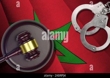 Morocco flag with judge mallet and handcuffs in dark room. Concept of ...