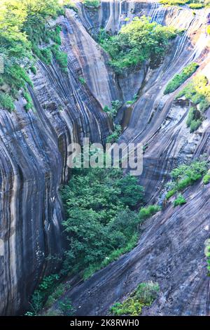 An aerial view of scenic rocky Gaoyi Ridge with scattered green ...