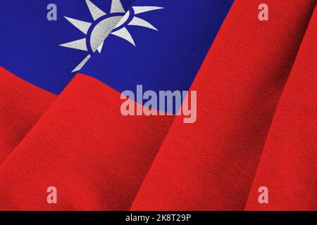 Taiwan flag with big folds waving close up under the studio light ...