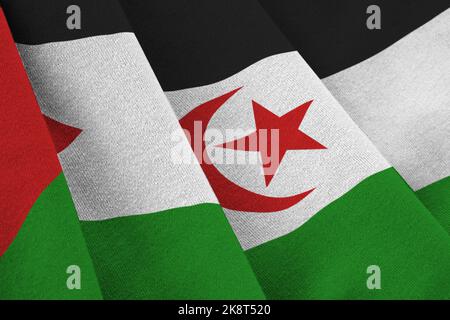 Western Sahara flag with big folds waving close up under the studio ...