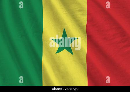 Senegal flag with big folds waving close up under the studio light ...