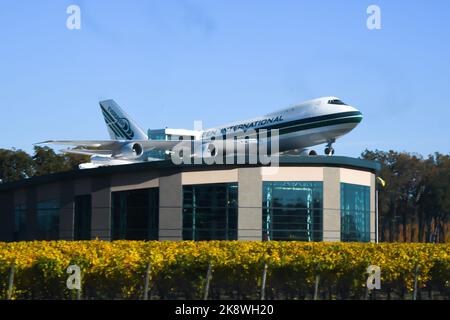 A Boeing 747-100 is mounted on building roof at Evergreen Aviation ...