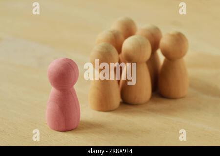 Pink pawn in leadership position with group of pawns - Concept of women ...