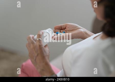 Elderly Asian Woman taking pill at home. Age, Medicine, Healthcare and ...