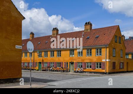 Distinctive yellow terraced houses in the Nyboder district of ...