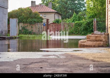 A giant puddle in the yard Stock Photo - Alamy