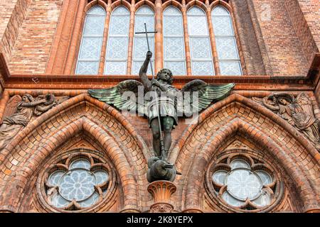 Statue of Archangel Michael killing the snake, Christian church ...