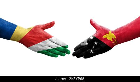 Handshake between Papua New Guinea and Tonga flags painted on hands ...
