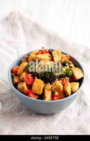 Homemade One-Pan Chicken And Broccoli Stir-Fry in a Bowl on a white ...