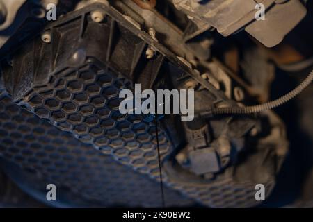Engine oil flows out of the hole Stock Photo - Alamy