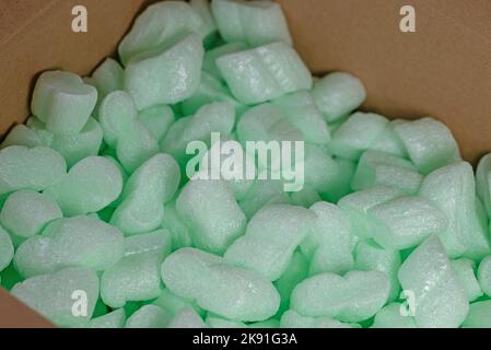 Packing chips, filling material in cardboard box Stock Photo - Alamy