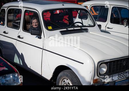 A classic white Renault 4 car with a granny inside Stock Photo - Alamy