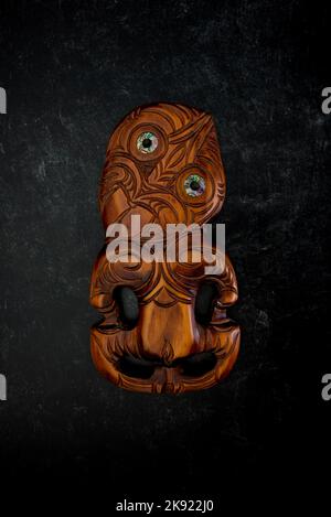 Wooden Maori Hei Tiki hand carved with paua shell eyes. New Zealand ...