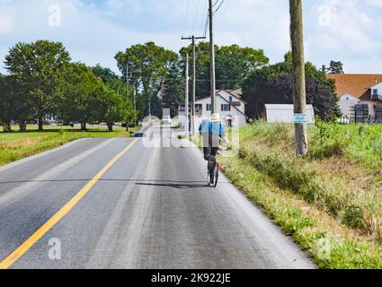 Amish man riding scooter, Lancaster County, Pennsylvania, USA Stock ...