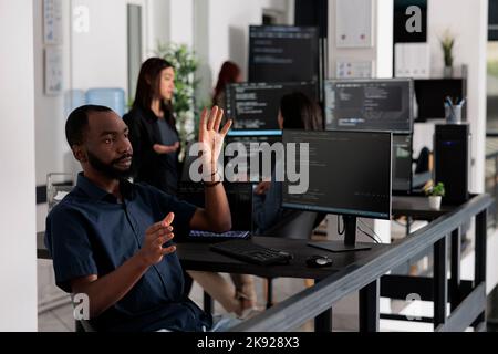 Asian web developer working with hologram and coding language in ...