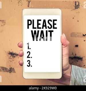 Hand writing sign Please Wait. Business concept to pause any implemented action immediately and ...