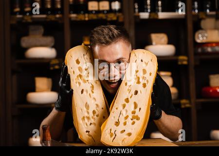 Funny crazy cheese sommelier with 2 pieces of limited maasdam natural ...