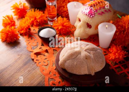 Pan de Muerto with sugar skull and Cempasuchil flowers or Marigold and ...