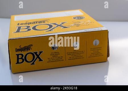 Leopards courier service yellow cargo box closeup Stock Photo - Alamy