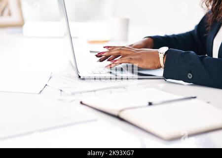 Success flows through her fingertips. an unrecognizable businesswoman ...