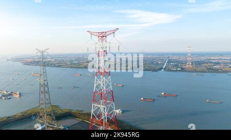 WUXI, CHINA - OCTOBER 25, 2022 - Cargo ships sail along the Yangtze River, flanked by the world ...