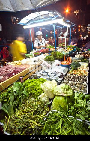 BANGKOK - DEC 21: fresh fish and vegetables offered at the night market ...