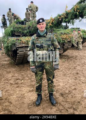 Pabrade, Lithuania. 26th Oct, 2022. Soldiers stand in front of a ...