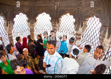 DELHI - NOVEMBER 09: Muslim pilgrims in the top of the minaret of the ...