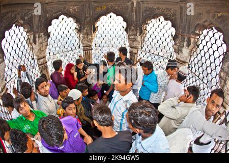 DELHI - NOVEMBER 09: Muslim pilgrims in the top of the minaret of the ...