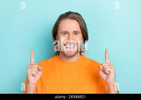 Photo of attractive male recommend you new online shop show phone touch ...