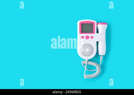 Fetal doppler on blue background Stock Photo - Alamy