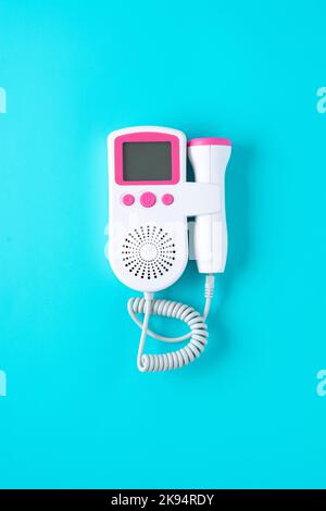 Fetal doppler on blue background Stock Photo - Alamy